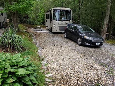 Class A Motorhome On Gravel Site Surrounded By Trees Rv Parks And