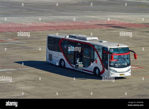 An Airport Bus Belonging To The Airline Air Asia Prepares To Pick Up