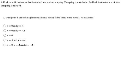 Solved A Block On A Frictionless Surface Is Attached To A Chegg Com