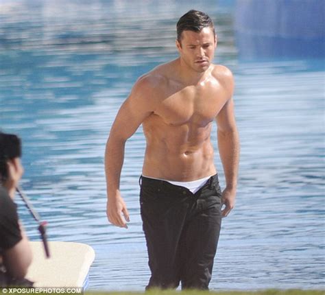 Mark Wright Shows Off His Toned Body As He Poses In Tight White Pants