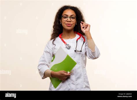 African American Woman Intern General Practitioner Hold Medical History Of Patient Dark Skinned