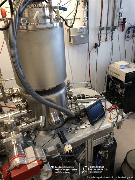 Low Temperature Scanning Tunneling Microscope With Magnetic Field And Microwave Excitation