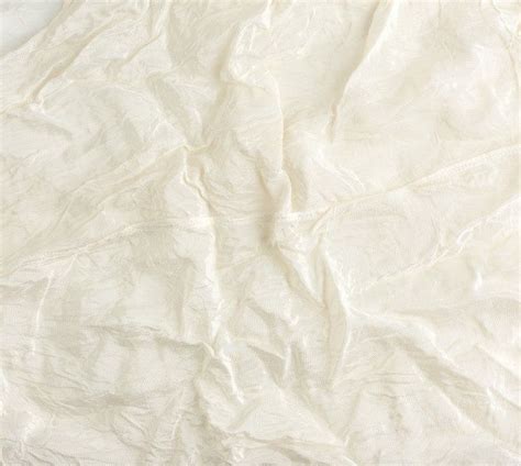 Мятая бежевая синтетическая ткань для изготовления подкладок для юбок Премиум Фото