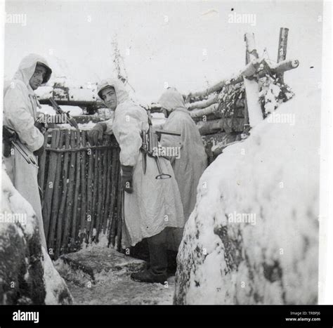German Soldiers In Winter Camouflage Clothing In A Defensive Position