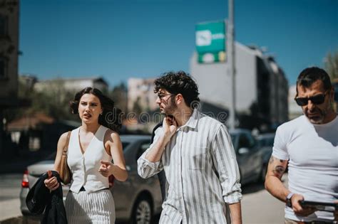 Cross Generational Colleagues Discuss Work In An Urban Setting Sharing