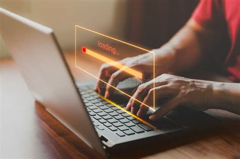 Adult Man Using A Laptop Computer For Download Software And Waiting To Loading Digital Business