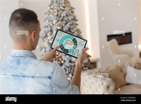 Man Holding Tablet With App Smart Home On Screen In Christmas Stock Photo Alamy