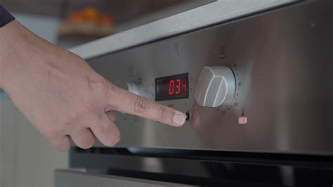 Woman Hand Setting Temperature Control On Oven Stock Video At Vecteezy