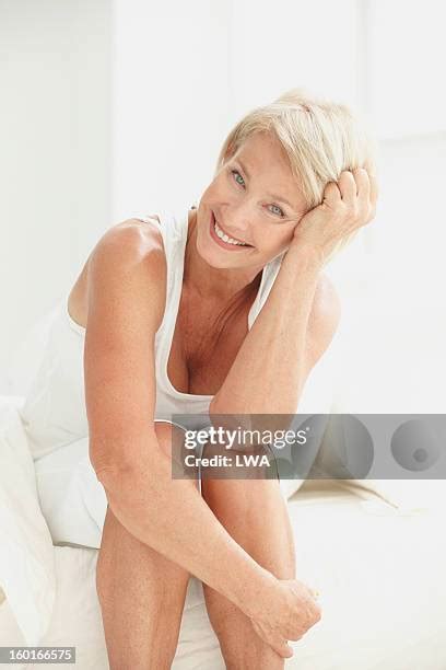 Older Woman Touching Hair Photos And Premium High Res Pictures Getty