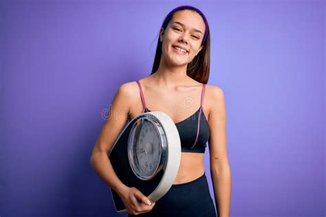 Young Beautiful Slim Sporty Girl Doing Sport Wearing Sportswear Holding