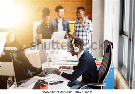 African Goodlooking Programmer Headphones Working Computer Stock Photo