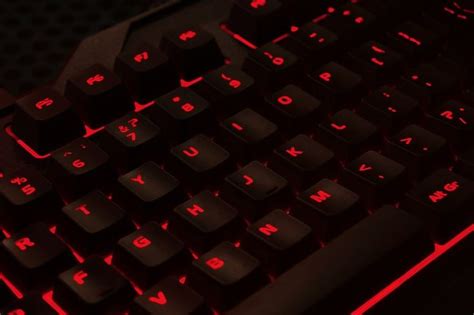 Backlit Gaming Keyboard Close Up Black Keys With Red Illuminated Characters