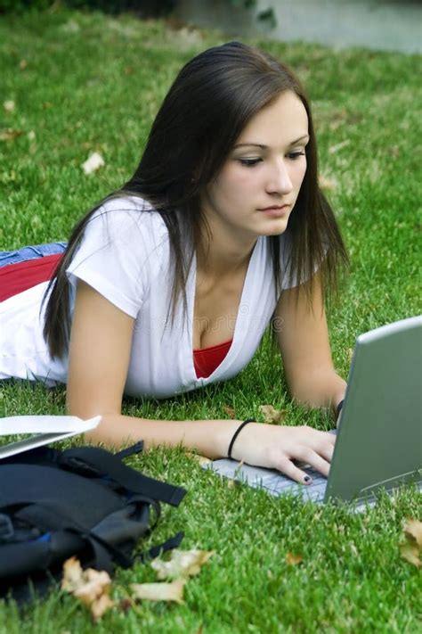 Cute Teen Girl Laying Down On The Grass Studying Stock Photo Image Of Park Education