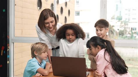 Cute Girl Programming System While Surround With Teacher And Friend