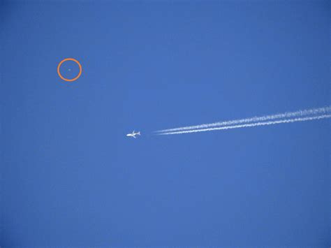 White Sphere Captured Above A Passenger Plane By Johnmooner Chief