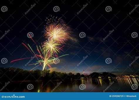 Beautiful Shot Of Glowing Exploding Fireworks In A Night Sky Over A