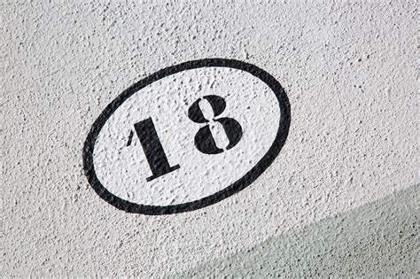 Premium Photo Number Eighteen On Stone Wall On Diagonal Tilt