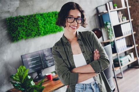 Young Woman Programmer In Casual Attire Smiling Confidently In A Modern Workspace With Coding