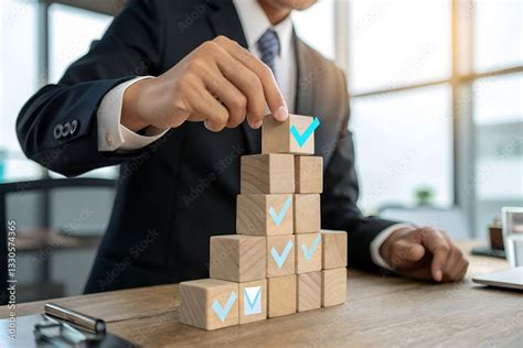 Fotografie Document Review Process And Quality Control Concept Hand Placing Checkmark Wooden