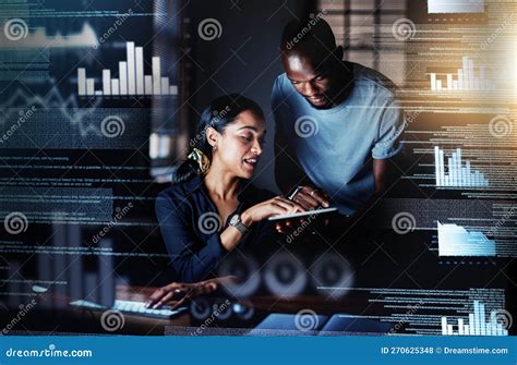 Adding Modifications To Their Plans Shot Of Two Programmers Using A Digital Tablet While