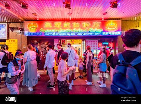 Australian People Queue For Takeaway Dumplings At Night Time During