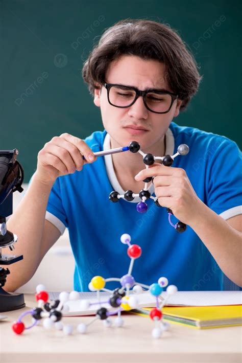 The Young Male Student In The Classroom Young Male Student In The