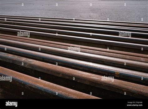 Many Used Rusty Rails Of Different Length Stored At A Ground For Old Rails Replacement Diagonal
