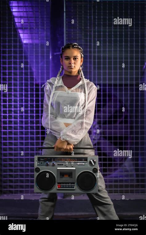 Young Girl With White Braids With A Boombox On An Urban Background