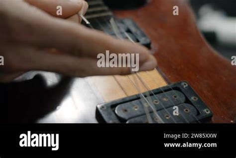 Guitar Tech Cuts The Strings On The Guitar By Nippers In Slow Motion Changing The Strings On