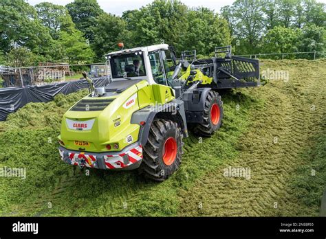 Working On A Silage Clamp With A Claas Laoder Using A Big Loader Grab