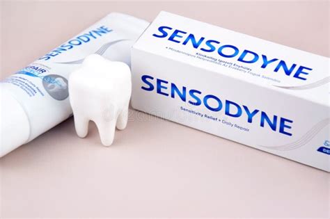 A Box Of Sensodyne Toothpaste On A Light Background Sensodyne Is A