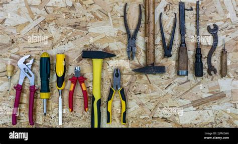 Old Rusty Tools Versus Modern Tools On The Osb Sheet Concept