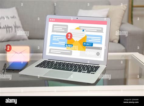 Laptop And Smartphone With Symbols Of New Unread Messages On Table