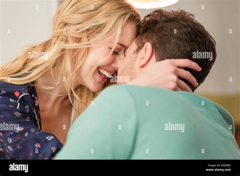 Couple Hugging Face To Face Smiling Stock Photo Alamy