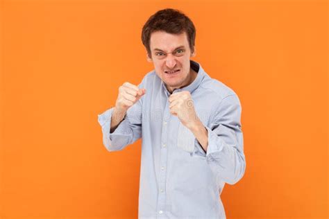 Angry Aggressive Man Standing Clenched Fists And Being Ready To Attack