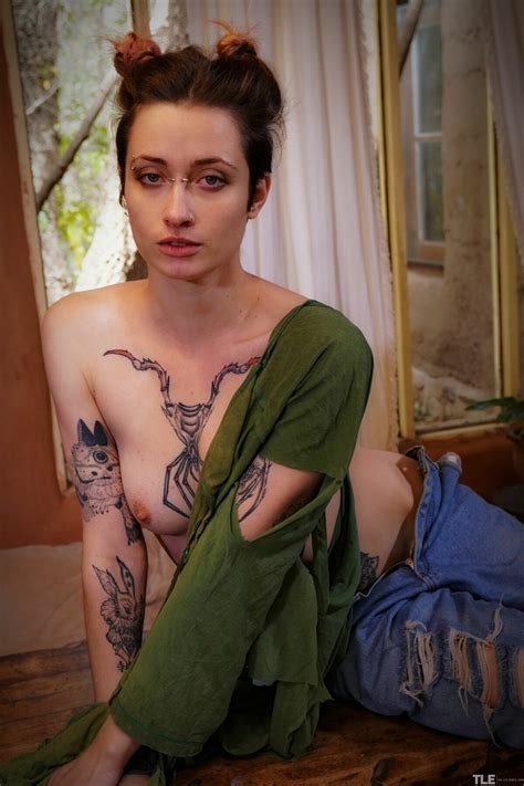 Tattooed Hottie Alena Teasing With Her Nude Body On The Table 14 Photos