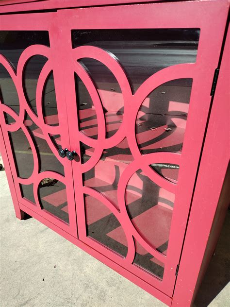 Burgundy Glass Front Storage Cabinet Roth And Brader Furniture