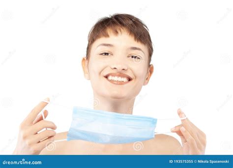 Happy Girl Pulling Off Her Medical Face Mask For Protection From Corona