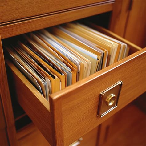 A File Cabinet Drawer Pulled Open Revealing Neatly Organized Files Premium AI Generated Image
