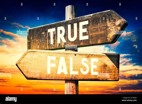 True False Wooden Signpost Roadsign With Two Arrows Stock Photo Alamy