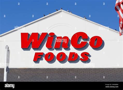 A Winco Foods Supermarket Sign On A Wall Against A Sunny Sky Stock