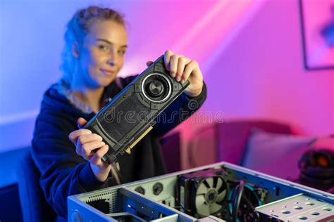 E Sport Gamer Girl Installing New GPU Video Card In Her Gaming PC Stock Photo Image Of Focused