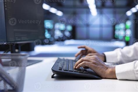Programmer Typing On Keyboard Optimizing Data Center Performance And