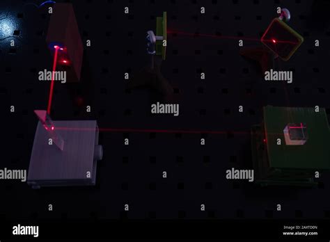 Experiment In Optic Lab With Laser Device Red Laser On Optical Table In Physics Laboratory