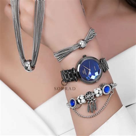 ساعت الگانس زنانه شیشه منشوری ساده بند استیل رنگ مشکی صفحه سرمه ای