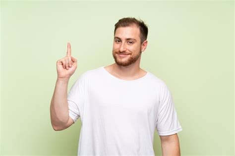 Premium Photo Handsome Man Pointing With The Index Finger A Great Idea