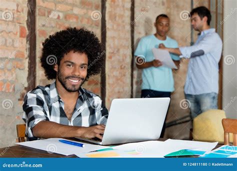 Laughing African American Hipster Software Developer At Computer Stock