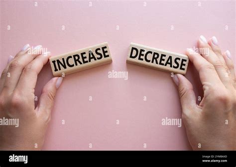 Increase Or Decrease Symbol Concept Word Increase Or Decrease On Wooden Blocks Businessman