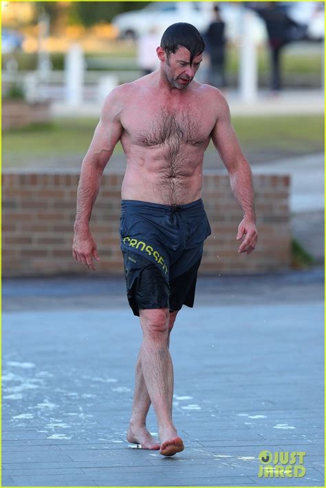 Hugh Jackman Runs Shirtless On The Beach With His Ripped Muscles On