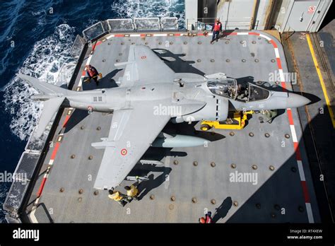 An Av 8b Harrier Ii Jet Aboard The Italian Navy Cavour Aircraft